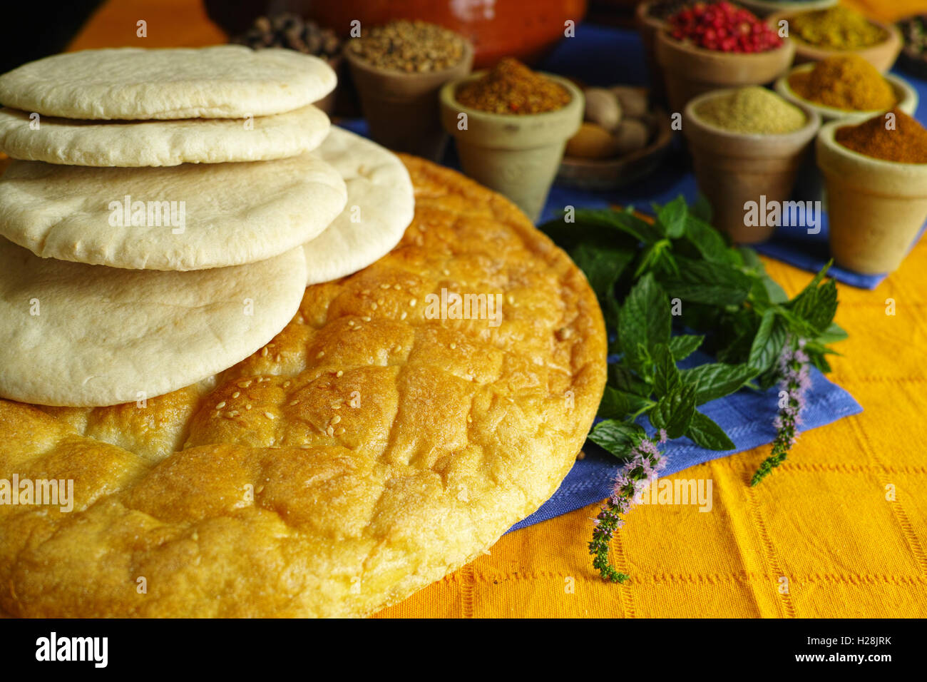 Traditional fresh turkish bread pita and collection of different spices ...