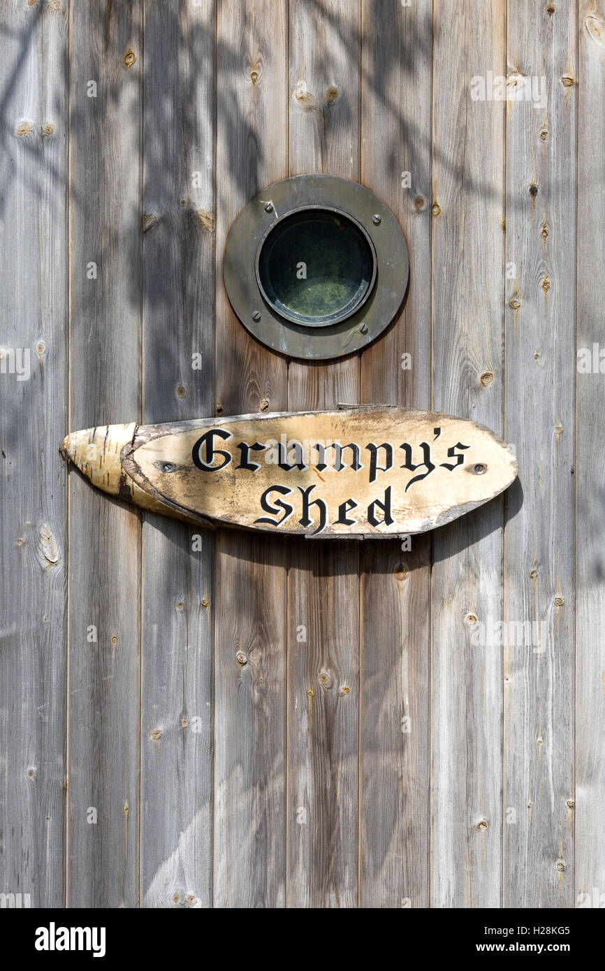 Wooden sign for Grumpy's shed Stock Photo - Alamy