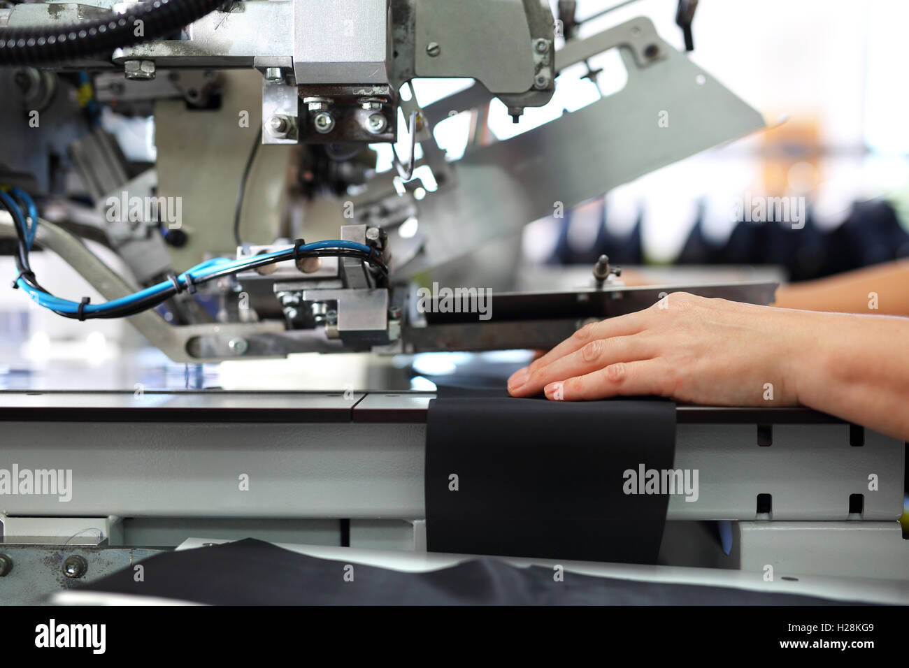 Seamstress On The Machine Production Of Clothes Sewing On A Machine