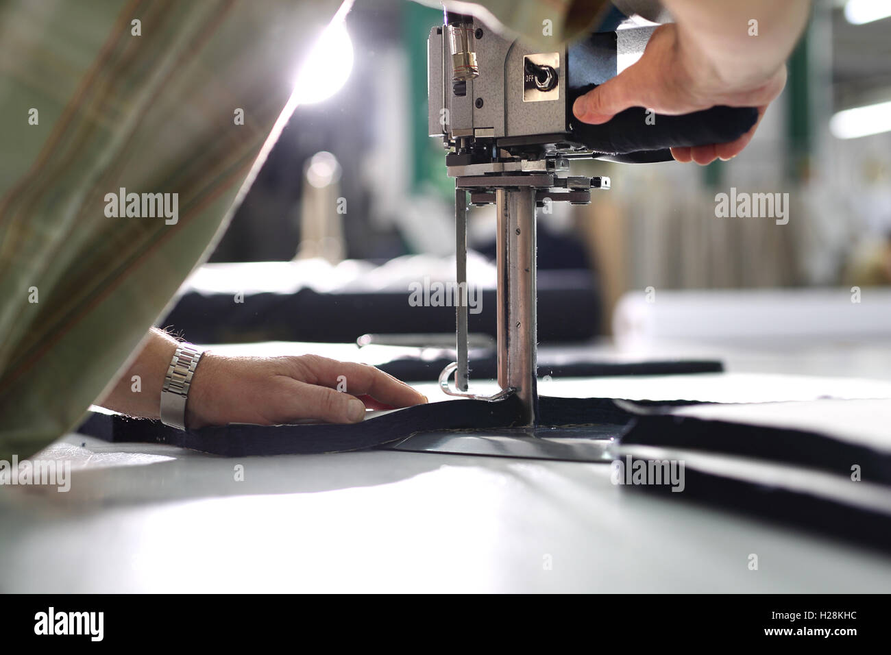 Cutting the fabric, sewing work. Manufacture of wearing apparel ...