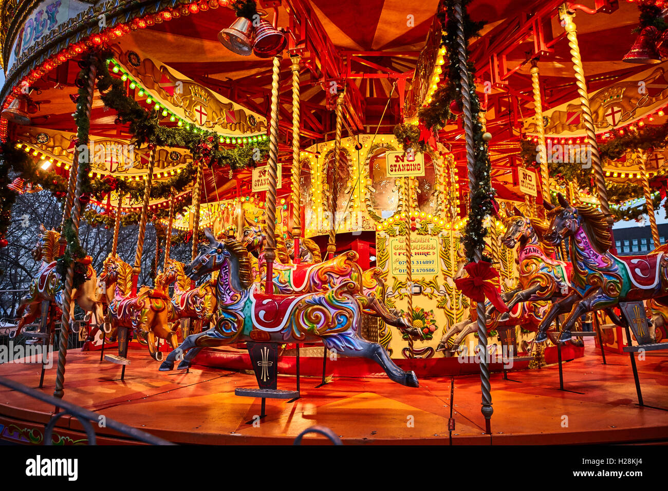 Colorful carousel at the fair before Christmas Stock Photo - Alamy