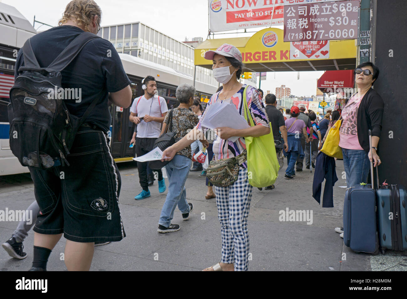 Handing out flyers hi-res stock photography and images - Alamy