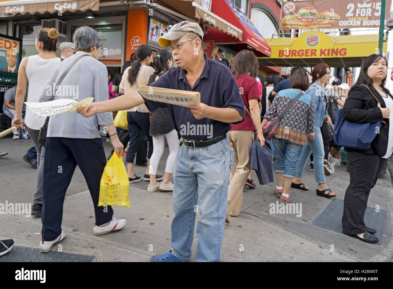 Handing out flyers hi-res stock photography and images - Alamy