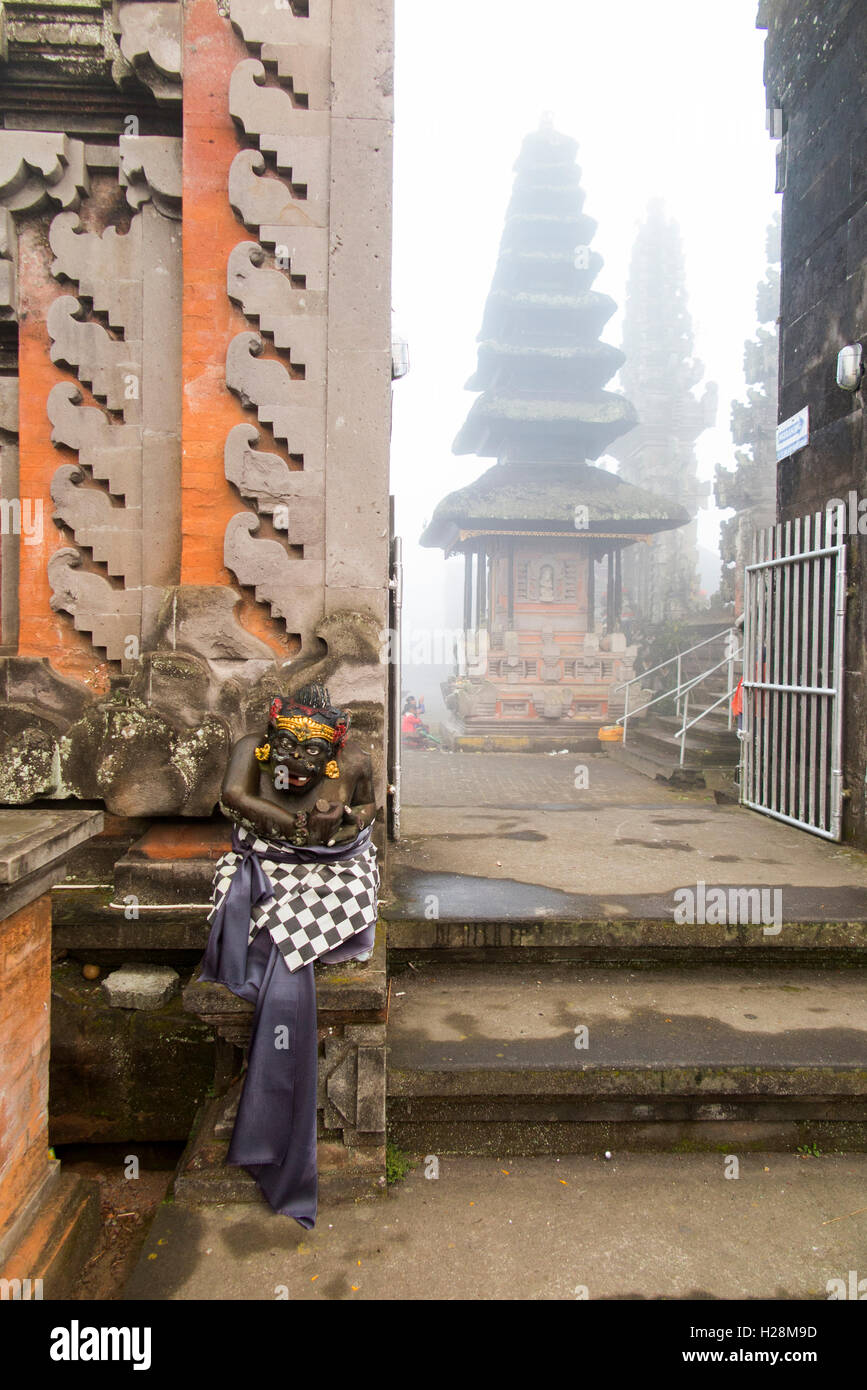 Indonesia, Bali, Batur, Pura Ulun Danu Batur, figure wrapped in Saput ...