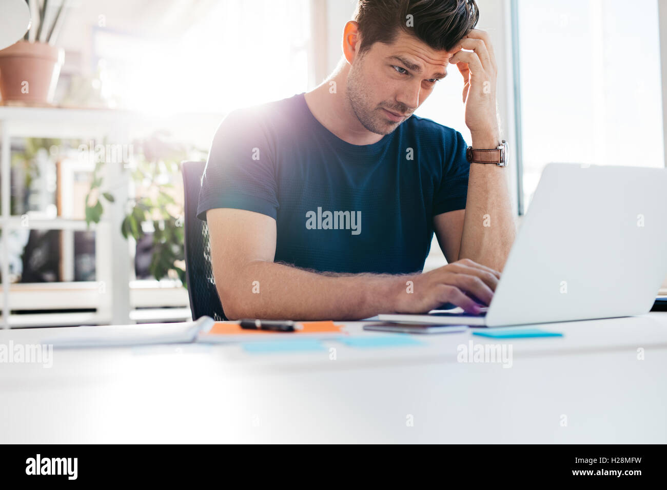 Work stressed man sitting desk hi-res stock photography and images - Alamy