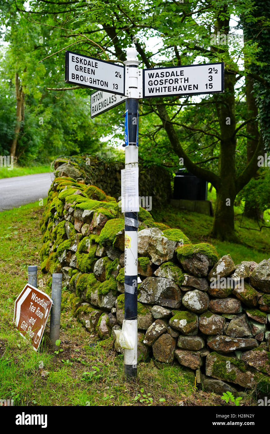 Direction sign post at Santon Bridge, Cumbria, England, UK Stock Photo ...