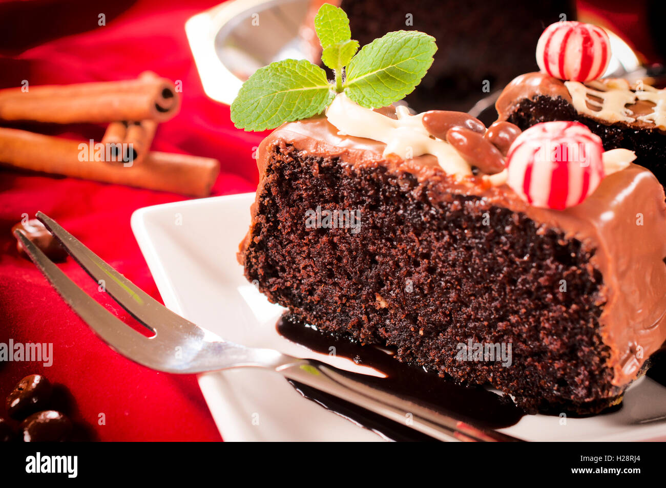 Piece of chocolate cake with icing Stock Photo - Alamy