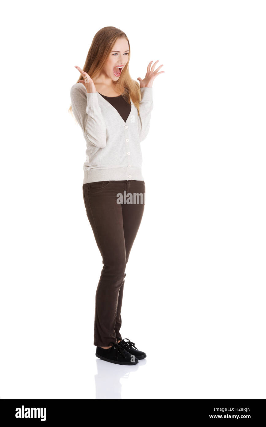 Beautiful positive and casual woman expressing surprise Stock Photo - Alamy