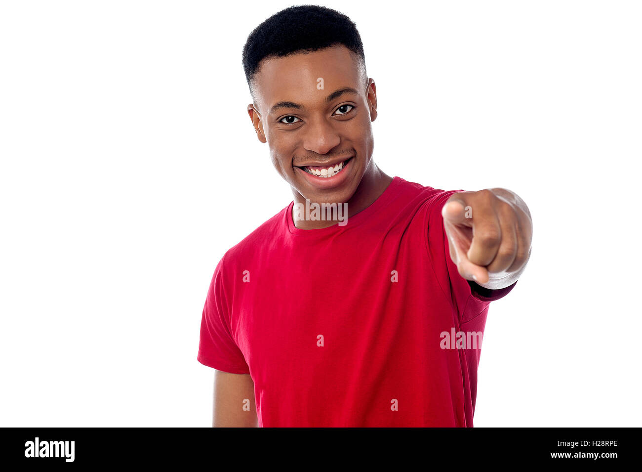 Cheerful guy pointing towards camera Stock Photo - Alamy Cheerful guy pointing towards camera Stock Photo - Alamy
