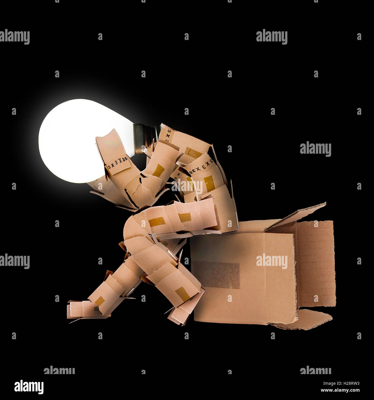 Light bulb box man character Stock Photo - Alamy