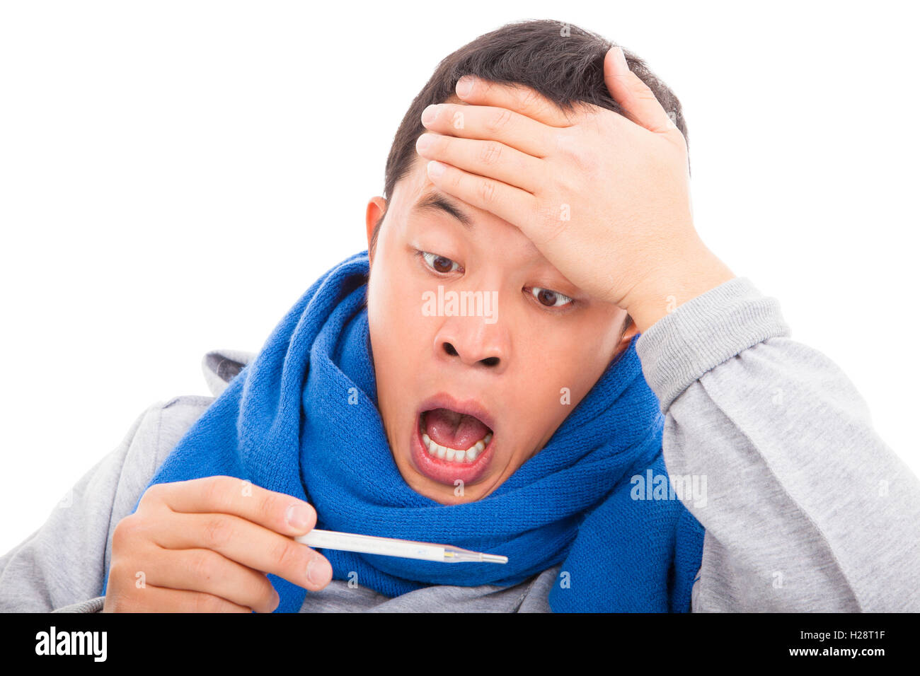 young man with a fever temperature, surprising expression Stock Photo ...