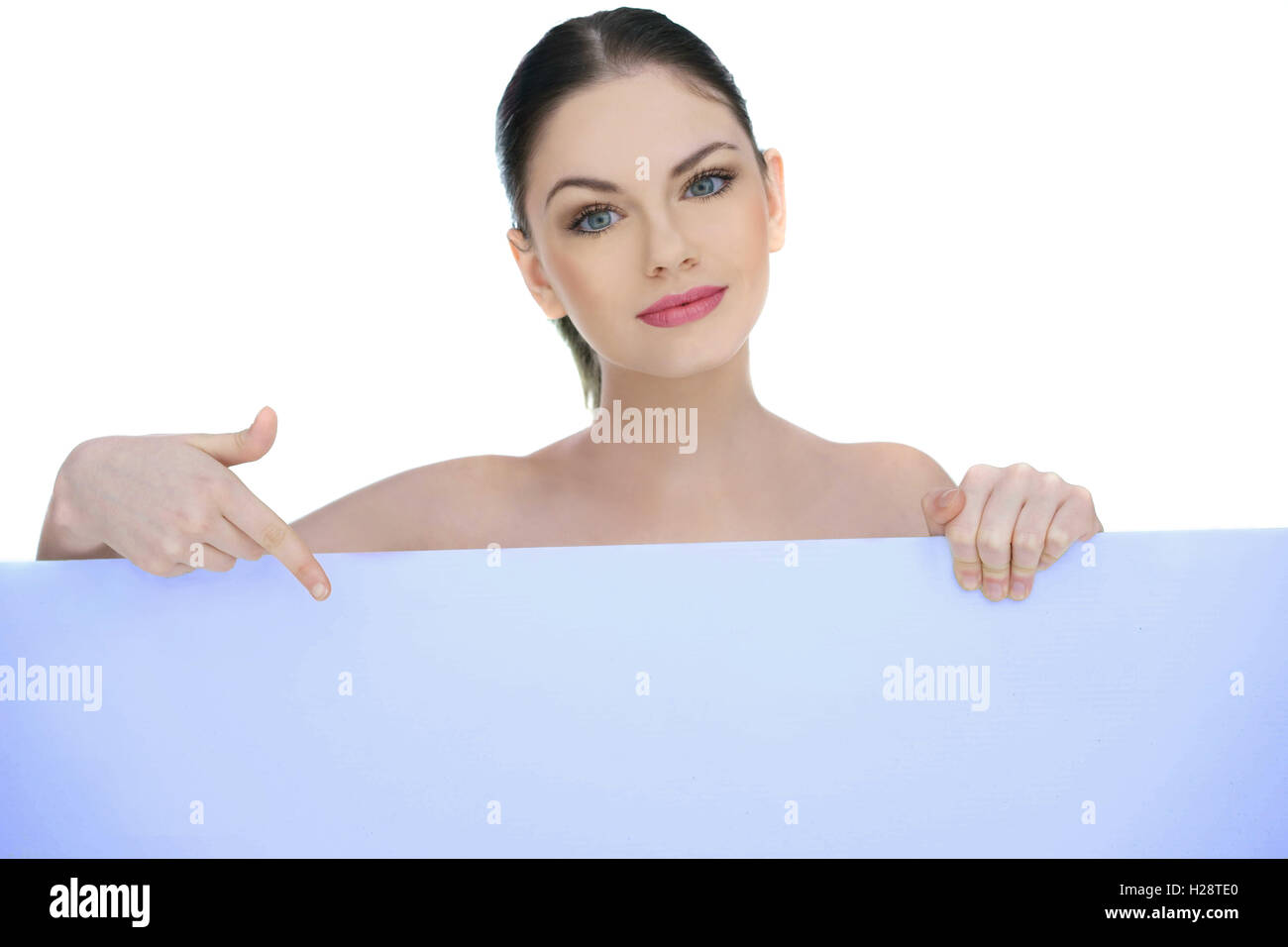 Beautiful woman pointing to a blank sign Stock Photo - Alamy