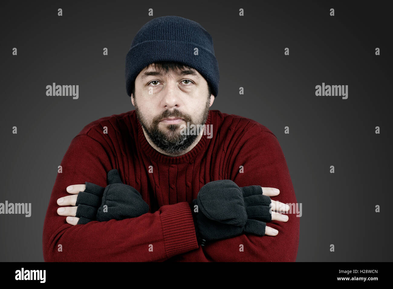 Desaturated homeless man with hat Stock Photo - Alamy