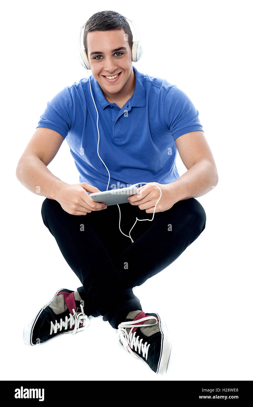 Smiling man enjoying music Cut Out Stock Images & Pictures - Alamy