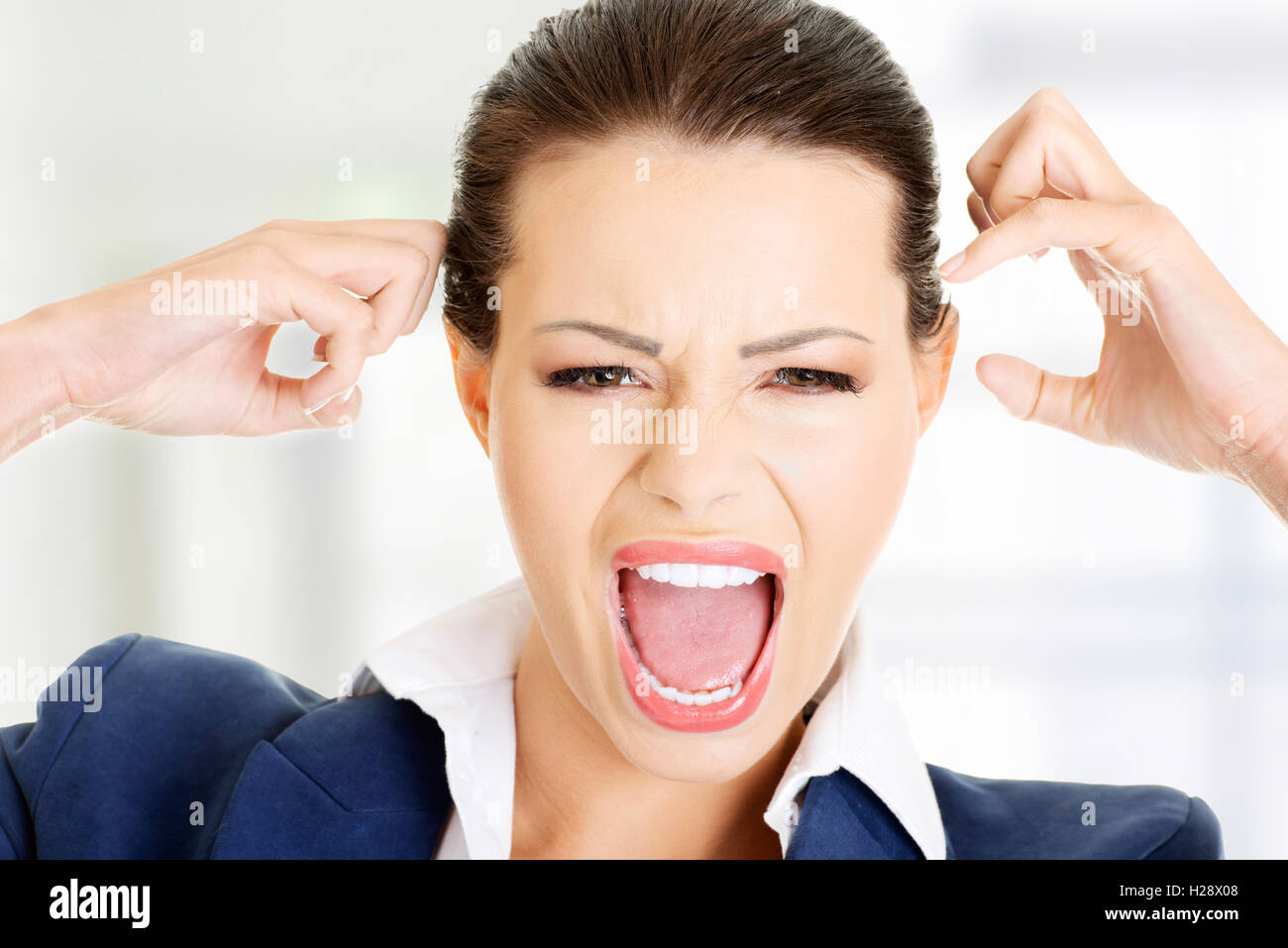 Stressed or angry businesswoman screaming loud Stock Photo - Alamy