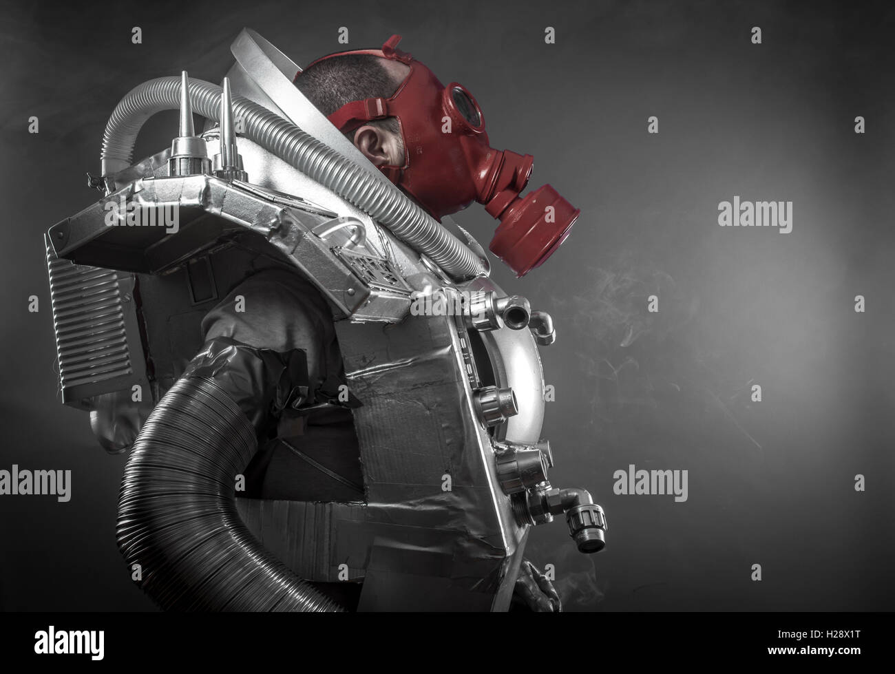 Astronaut with red gas mask on a black background with huge weap Stock ...