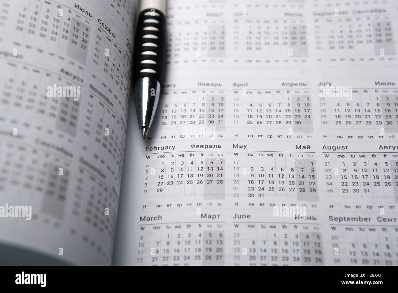 Calendar diary and pen Stock Photo - Alamy
