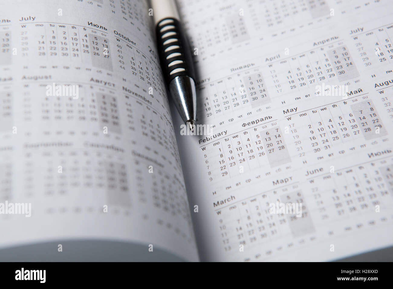 Calendar diary and pen Stock Photo - Alamy
