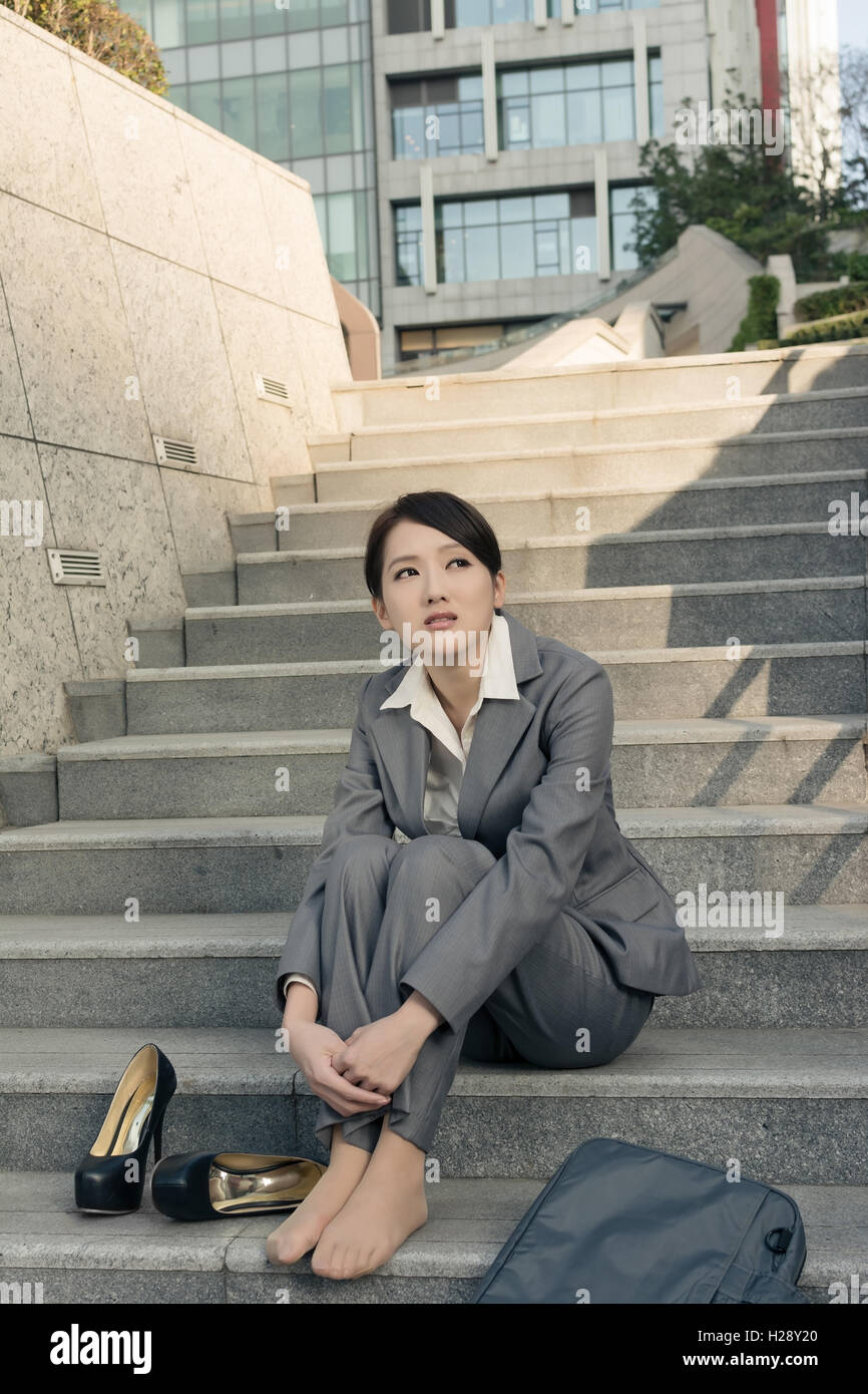 Sad business woman feel helpless Stock Photo - Alamy
