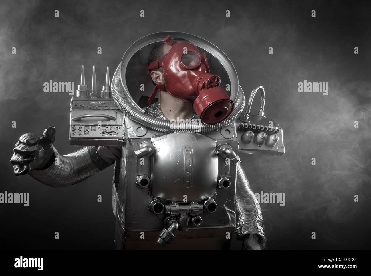 Astronaut with red gas mask on a black background with huge weap Stock ...