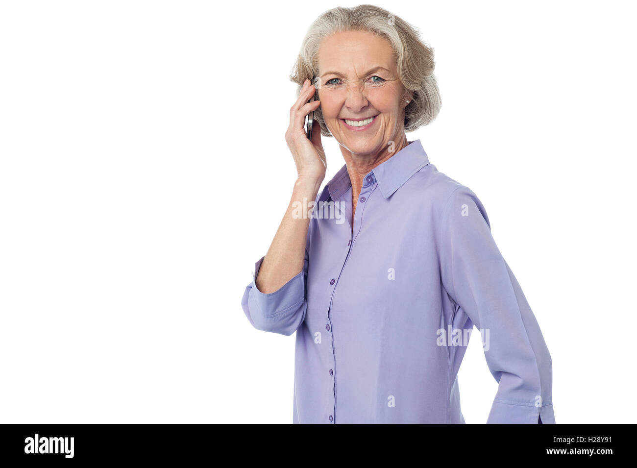 Aged woman attending phone call Stock Photo - Alamy