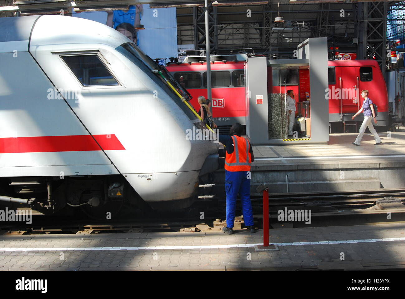 A railroad worker cleans the windshield on a train Stock Photo - Alamy