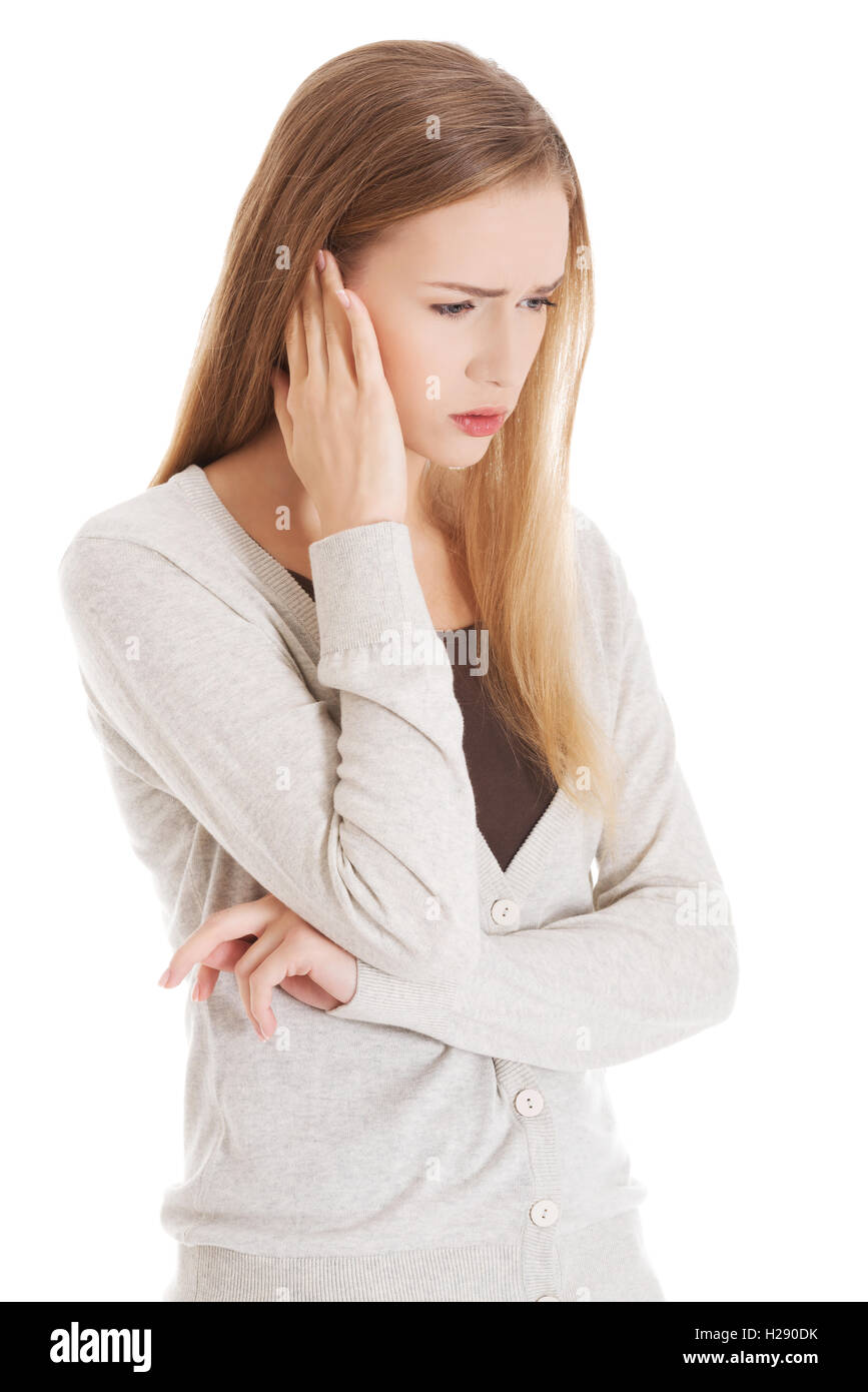 Beautiful casual woman is touching her ear Stock Photo - Alamy