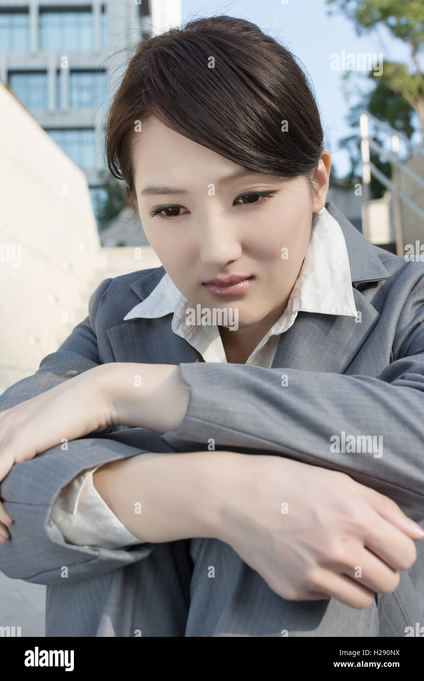 Sad business woman feel helpless Stock Photo - Alamy