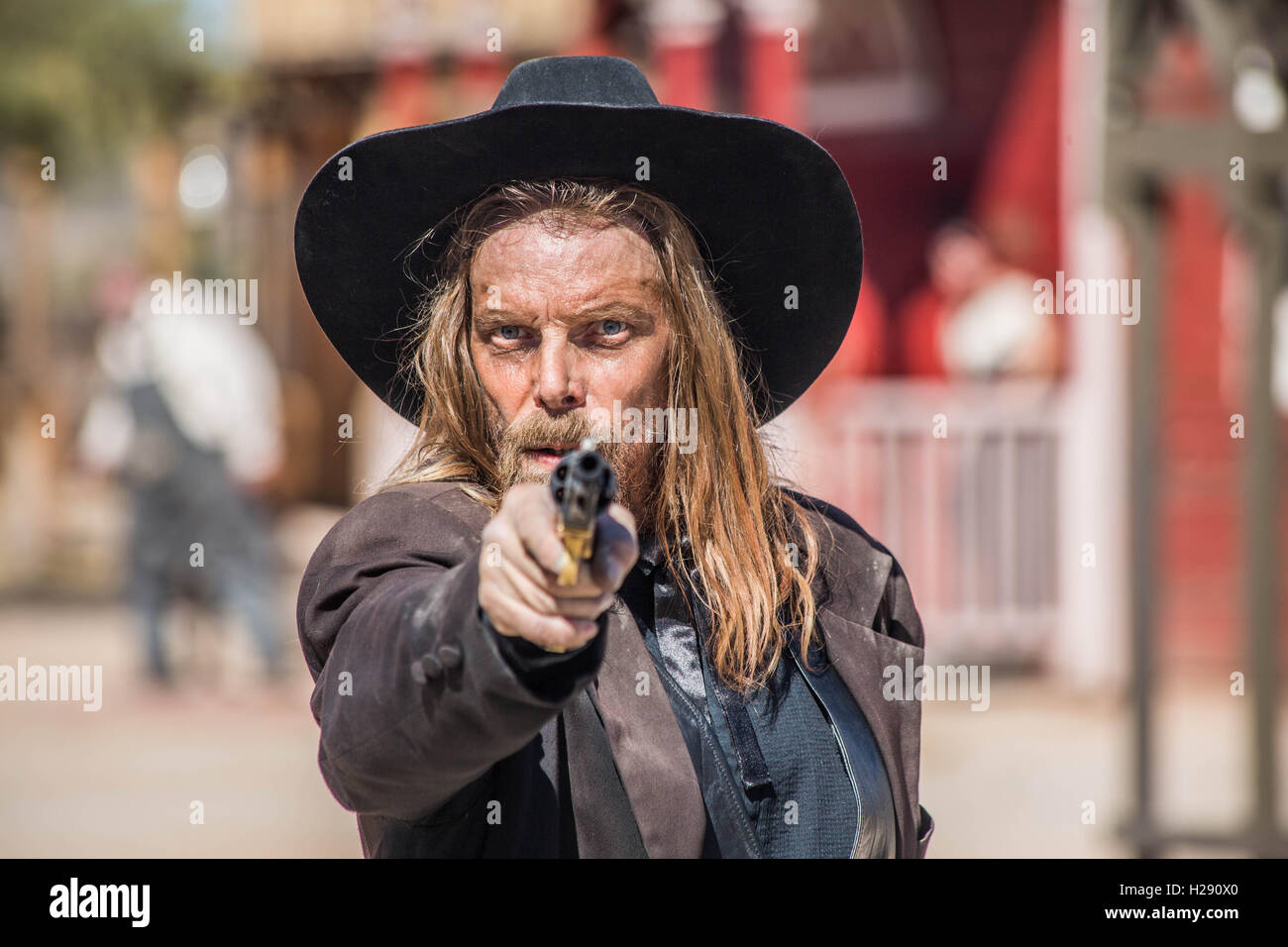Cowboy Points Gun at You Stock Photo - Alamy