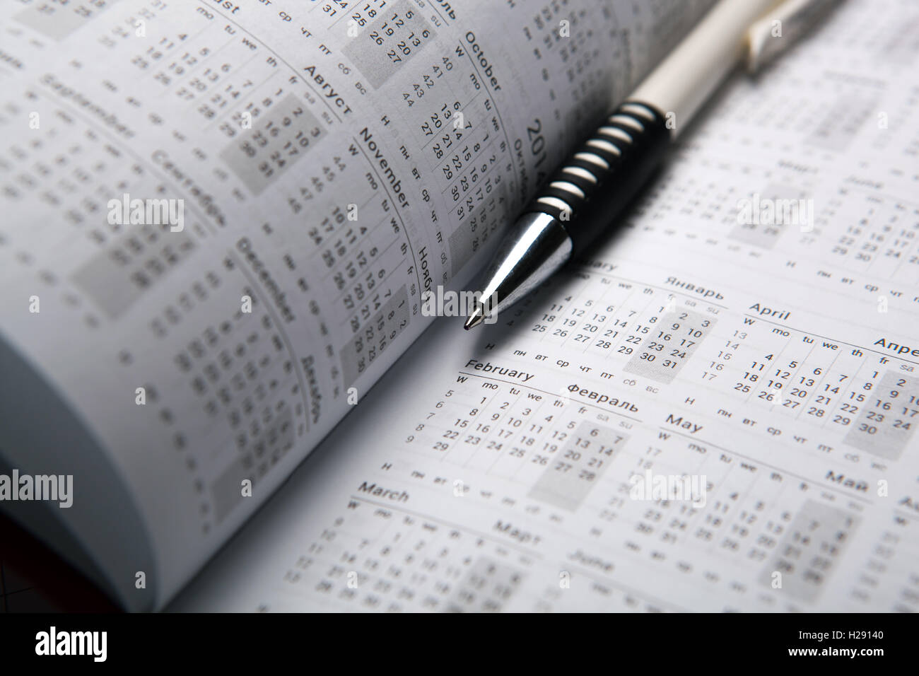 Calendar diary and pen Stock Photo - Alamy