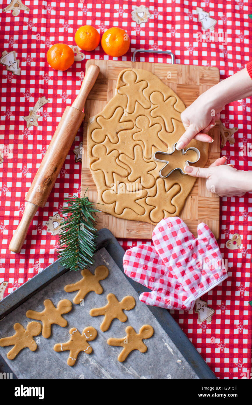 Hands making from dough Christmas gingerbread man Stock Photo - Alamy