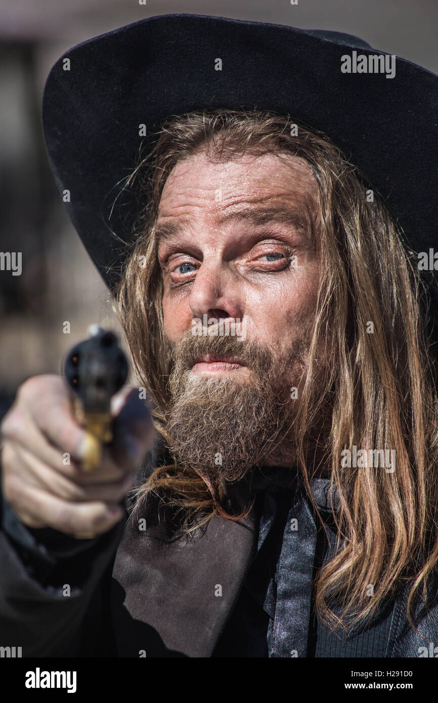 Cowboy Points Gun at You Stock Photo - Alamy