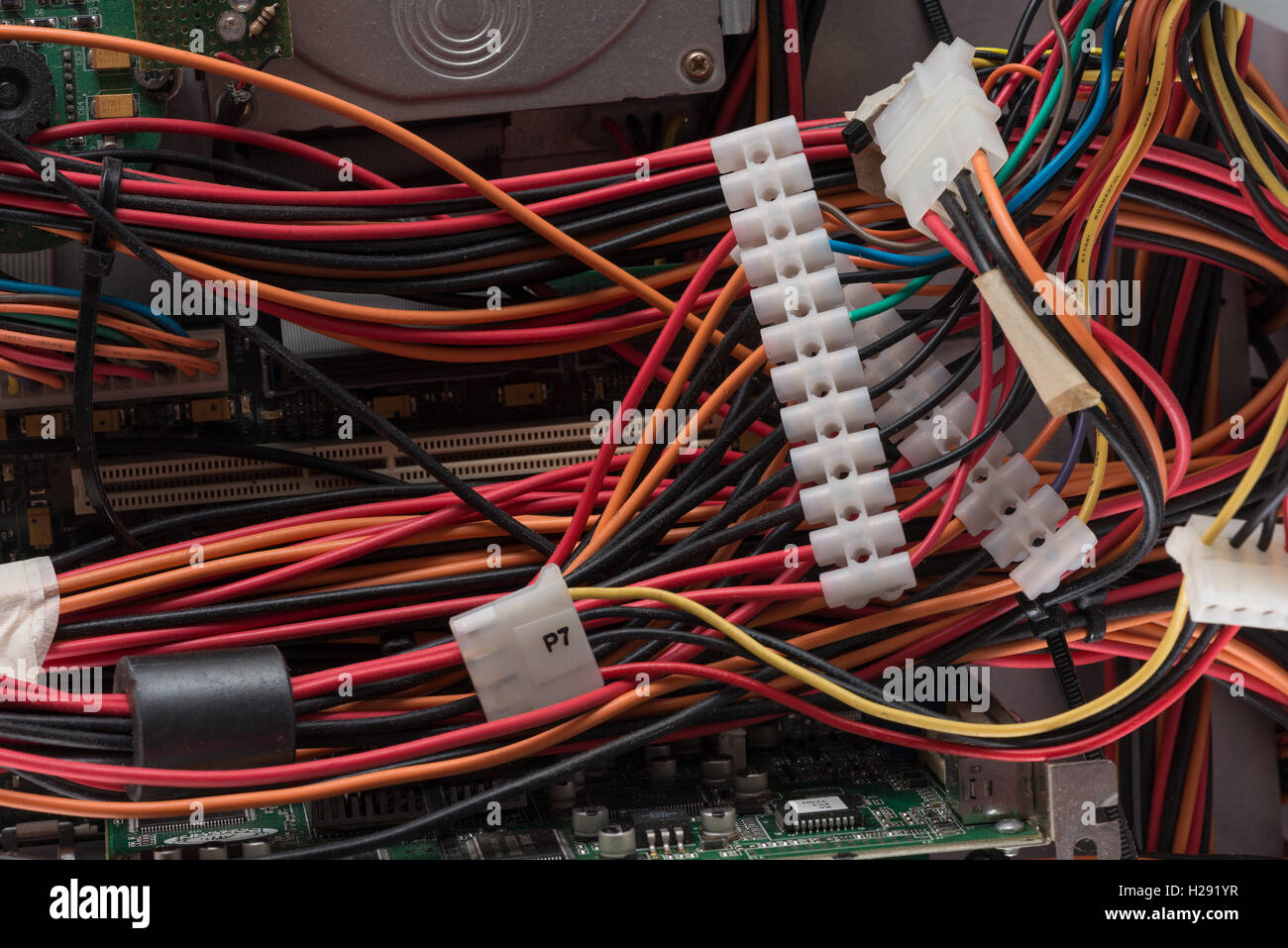 masses of colored computer wires with circuit board and harddrive ...
