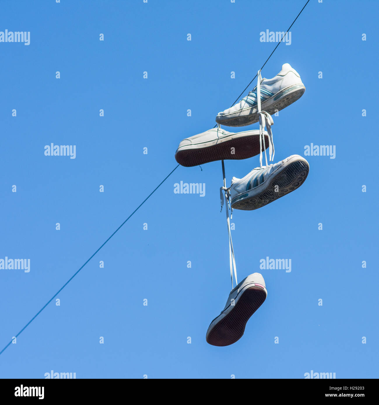 pairs of shoes hang in a rope Stock Photo - Alamy