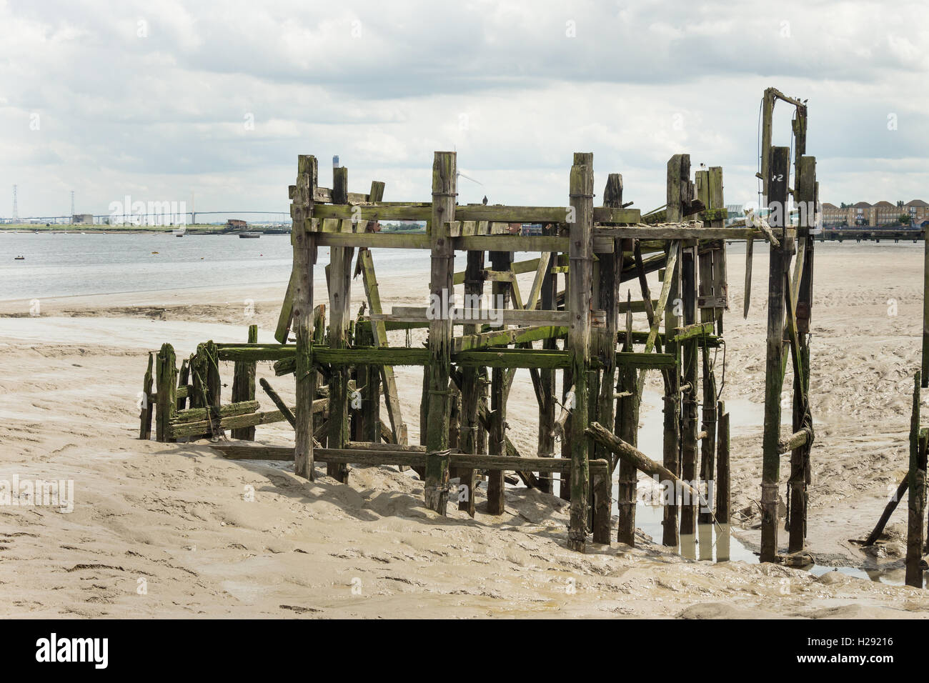 Derelict decaying ramshackle old pier sign of decreased river trade ...