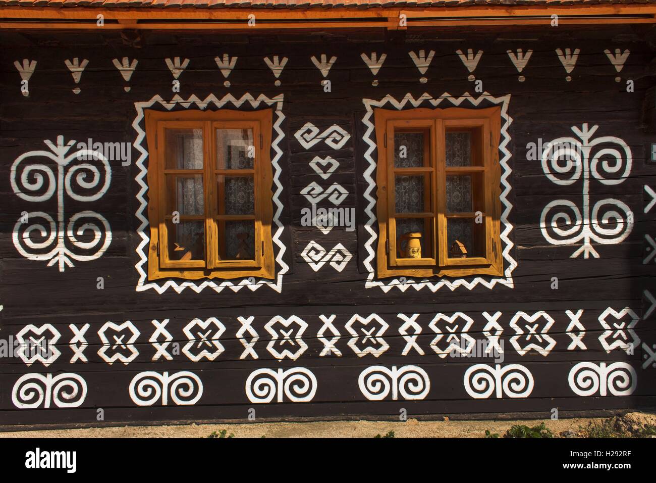 Traditional folk architecture. The old wooden house painted ornament ...