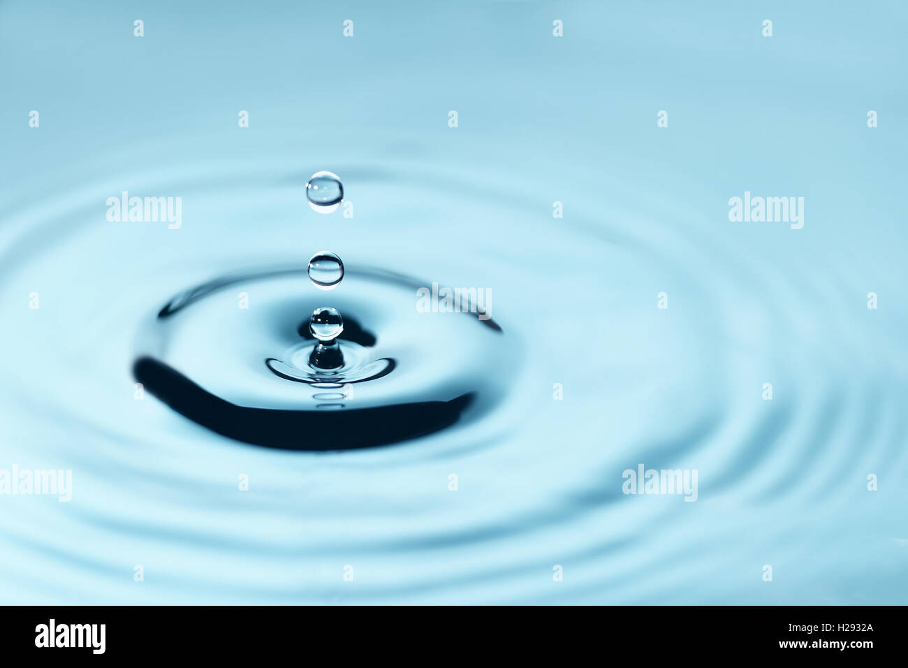 Three water drop falling abstract in blue hues Stock Photo - Alamy