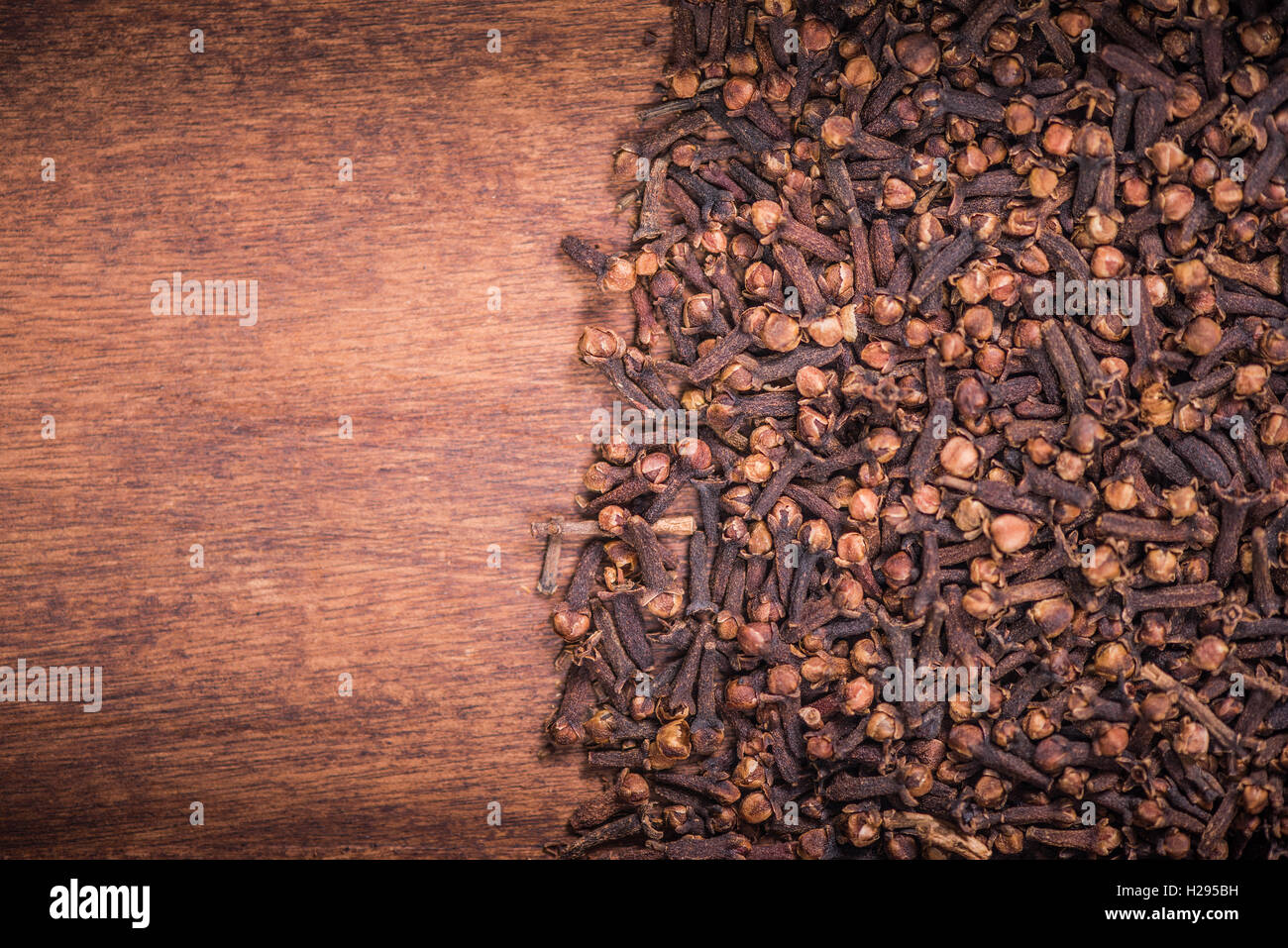 Claves spice, border background view from above Stock Photo - Alamy