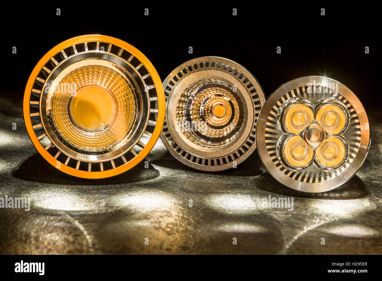 three LED GU10 bulbs with various plastic diverging lenses and ...