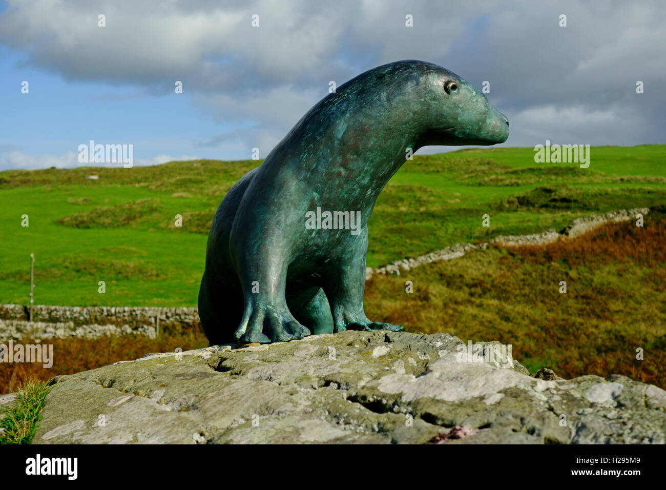 Gavin Maxwell memorial, a bronze otter on rocks at Monreith in Dumfries ...