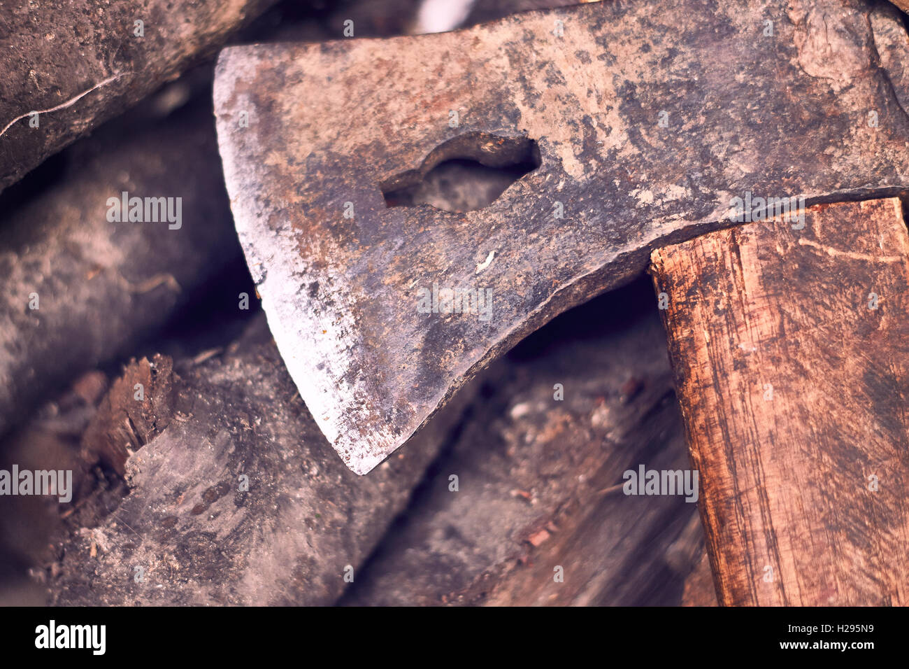 Rustic axe on pile of firewood. Copy space Stock Photo - Alamy