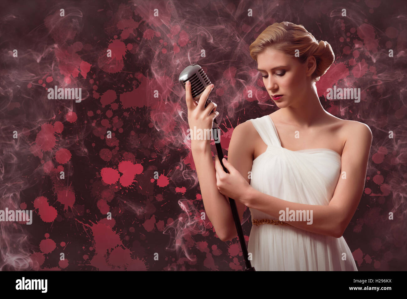 attractive female singer with microphone Stock Photo - Alamy