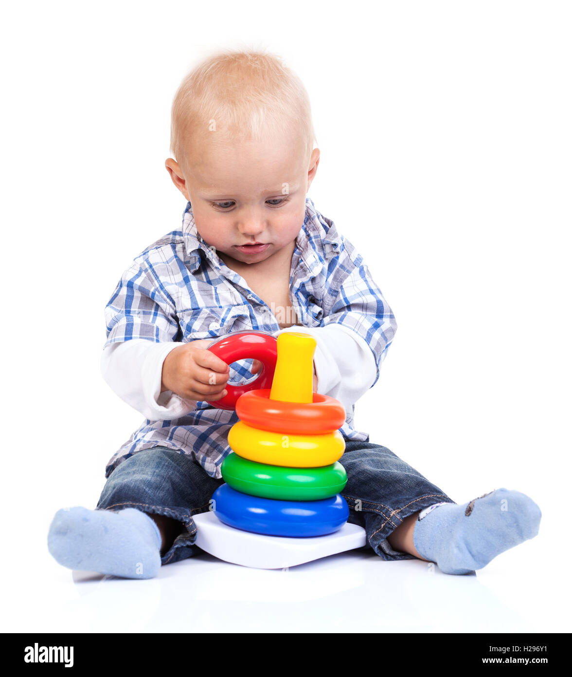 Cute little boy playing with pyramid toy Stock Photo - Alamy