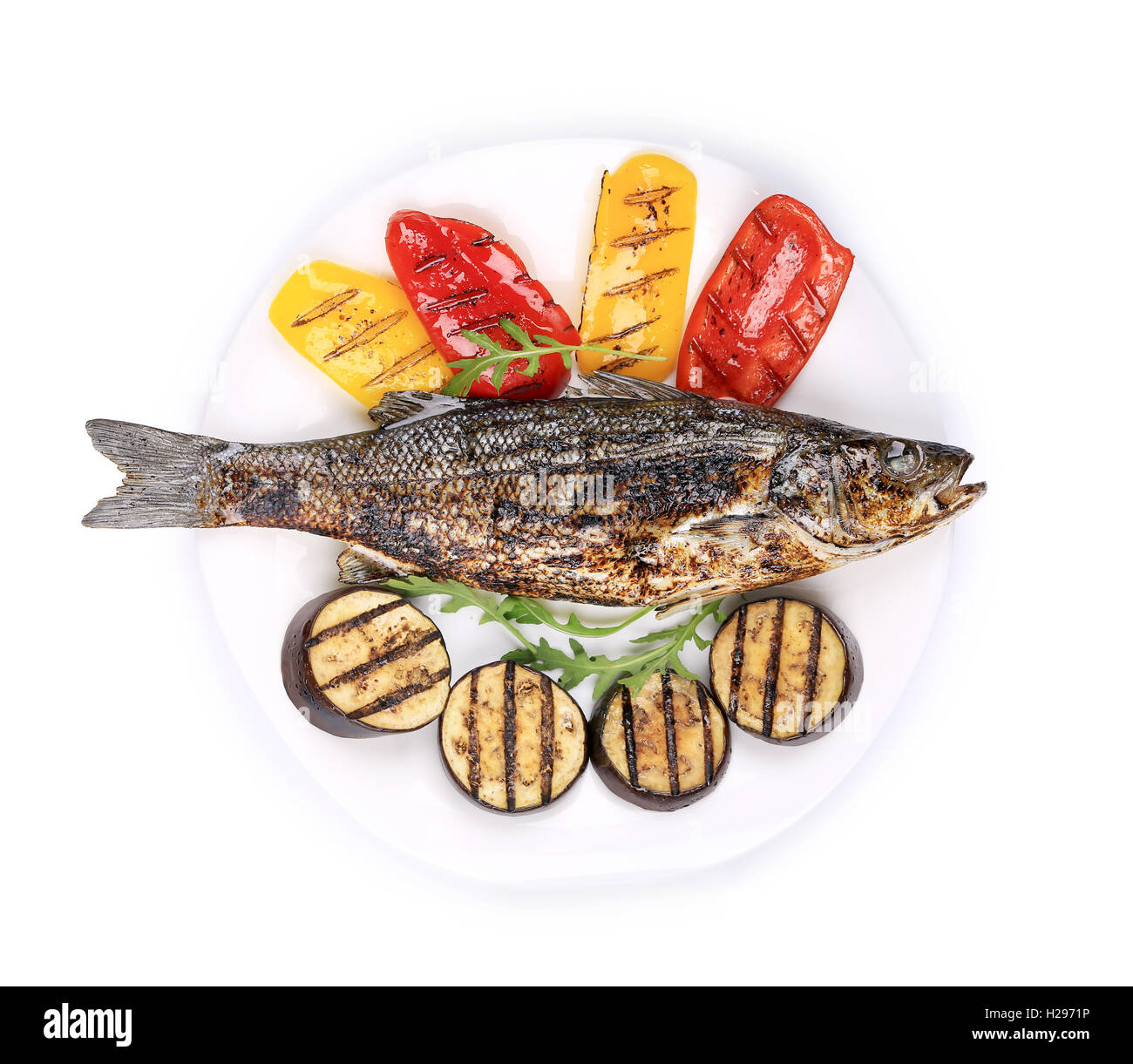 Grilled fish with vegetables Stock Photo - Alamy