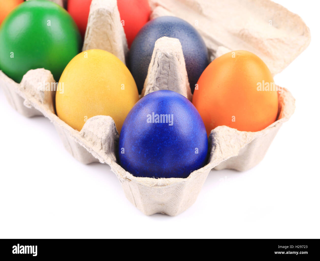 Cardboard egg box with Easter colored eggs Stock Photo - Alamy