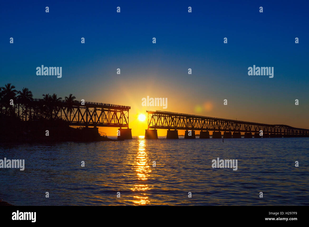 colorful sunset with broken bridge Stock Photo - Alamy