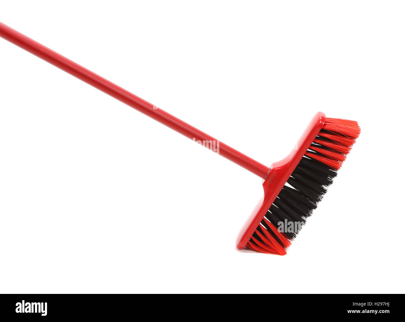 Close up of red black broom Stock Photo - Alamy
