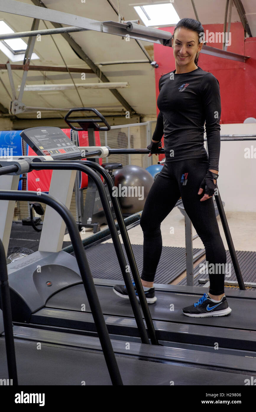 young female working out on a treadmill in a gym england uk Stock Photo ...