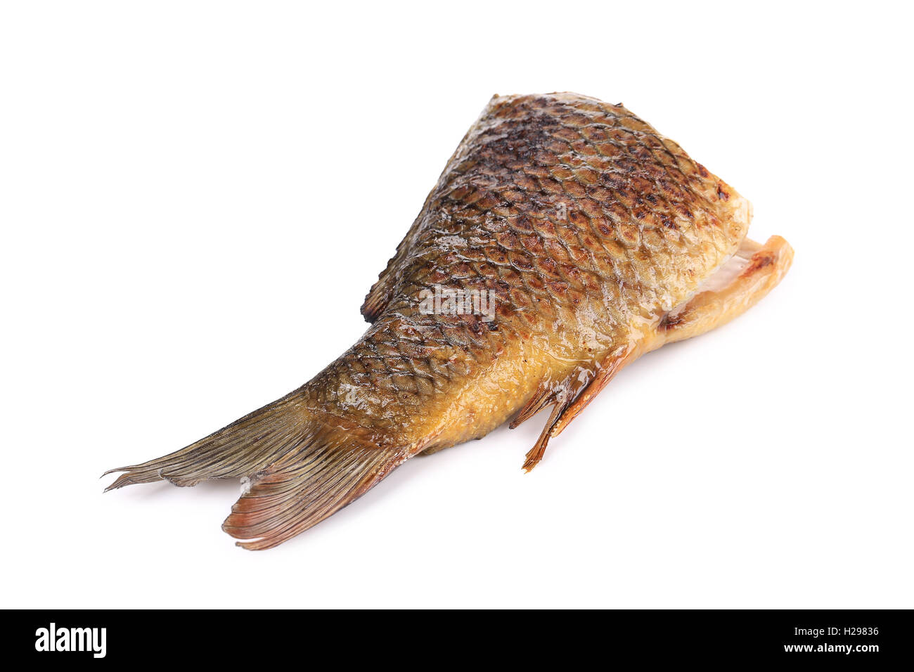 Fried fish tail Stock Photo - Alamy