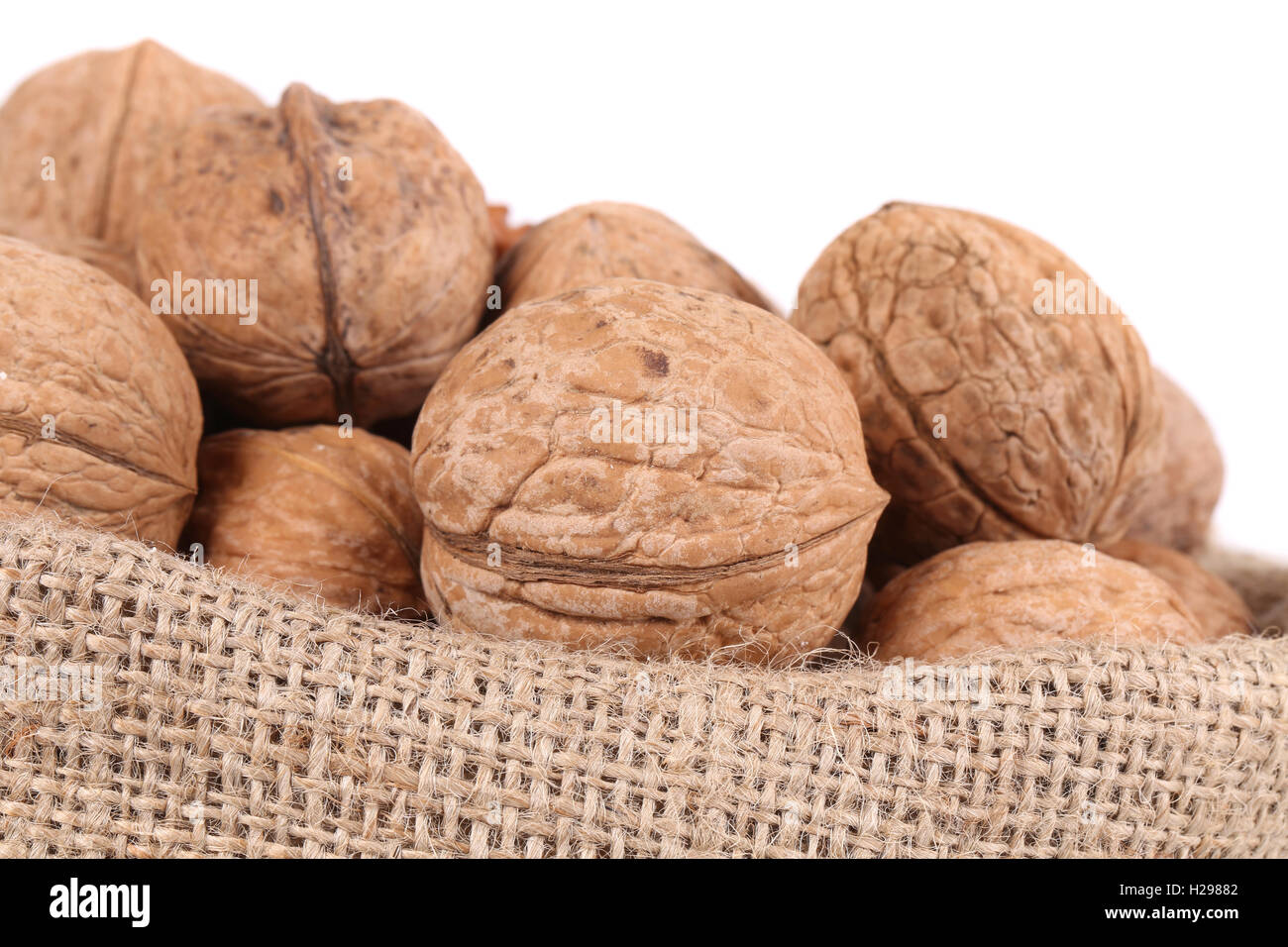 background Nuts with shells in burlap bag Stock Photo - Alamy